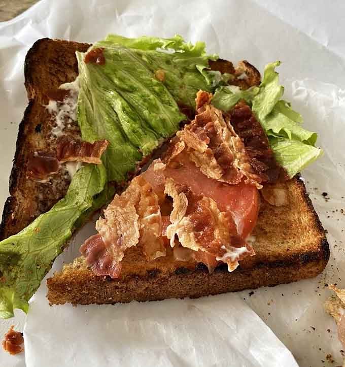 A BLT on wheat toast where the bacon is crispy, the lettuce is fresh, and everything is right.
