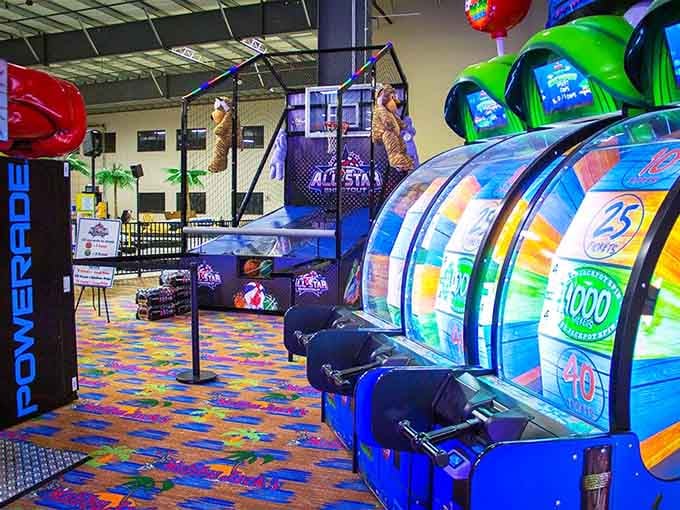 The arcade stretches into the distance like a neon-lit promise that your quarters will be well spent on pure entertainment.
