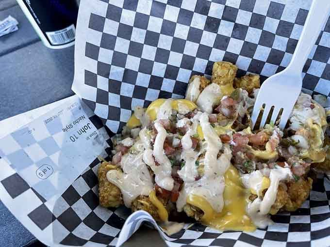 Nacho-style tater tots loaded with all the fixings, because sometimes regular tots just aren't living their best life.