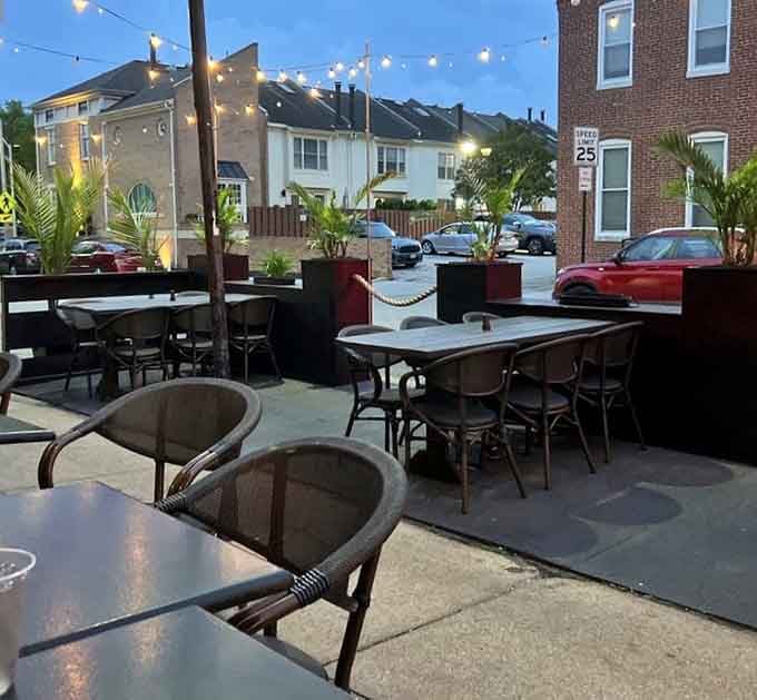 The patio at twilight with string lights glowing feels like dining in your coolest friend's backyard, but better.