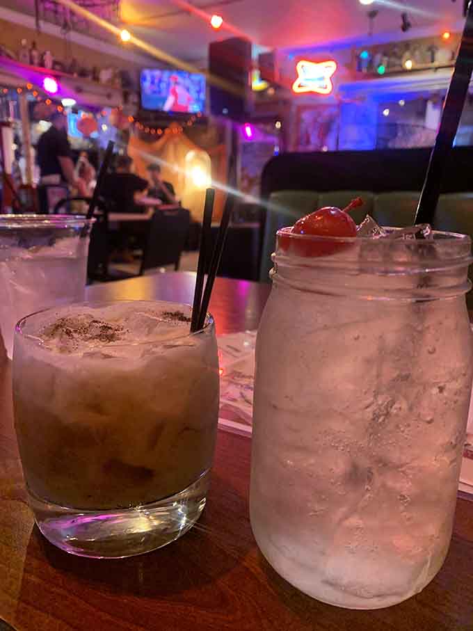 Cocktails at the bar taste better when you're surrounded by antiques and the glow of neon signs.