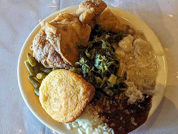 Rice, gravy, cornbread, and greens create a plate that tells Alabama's delicious culinary story.