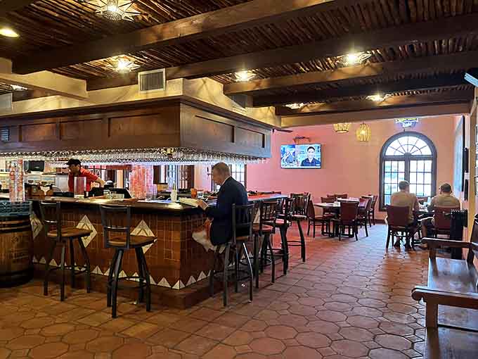 The bar area beckons with promises of perfectly crafted margaritas and front-row seats to all the culinary action.