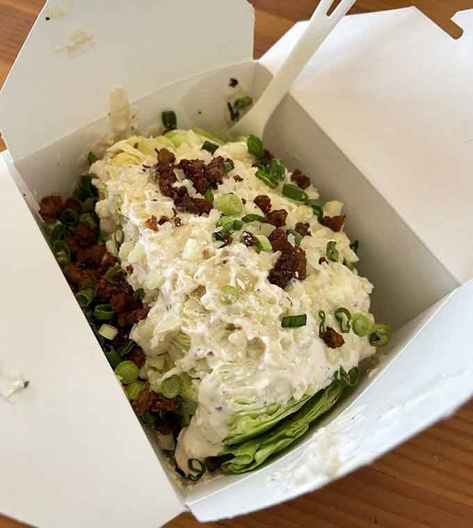 The Mean Wedgie salad arrives dressed to impress, proving even the vegetables here come with serious attitude and flavor.