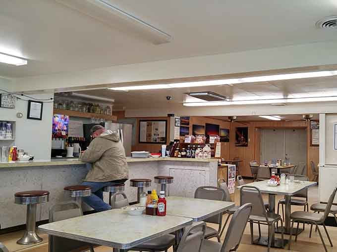 The dining room offers plenty of booth and table seating for families, friends, and solo diners alike.