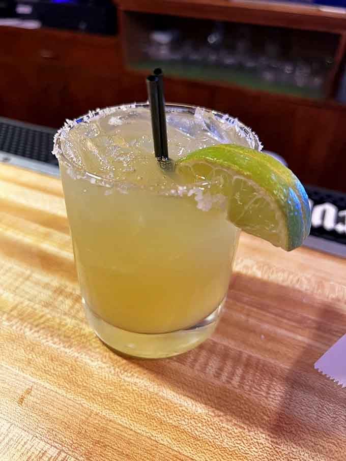 A proper margarita with that salt rim glistening like tiny diamonds, because you deserve something special today.