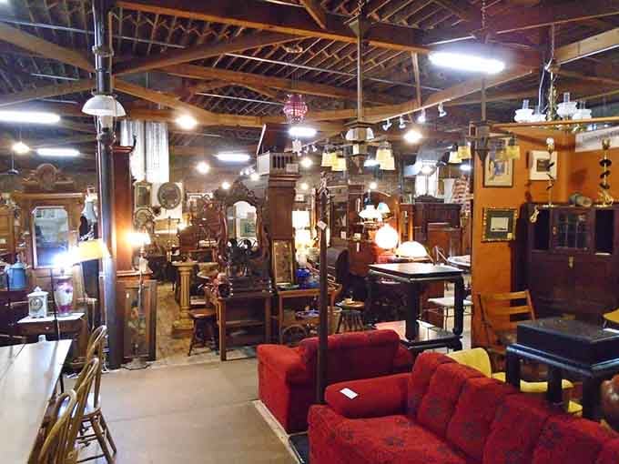 Floor lamps stand like sentries among furniture pieces, each one casting character into every shadowy corner here.