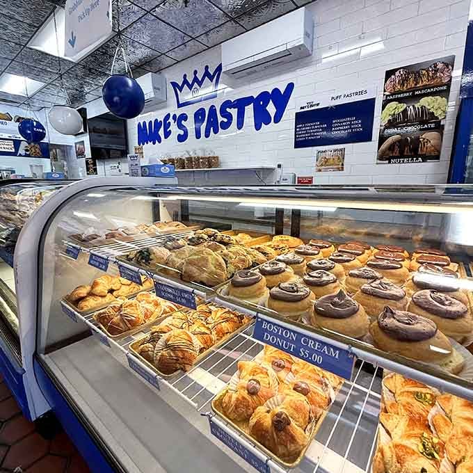 Behind the curved glass lies temptation in its purest form, rows of treats that make decision-making nearly impossible.