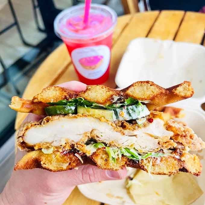That crispy fried chicken sandwich stacked impossibly high between mochi waffles is weekend brunch goals personified in handheld form.