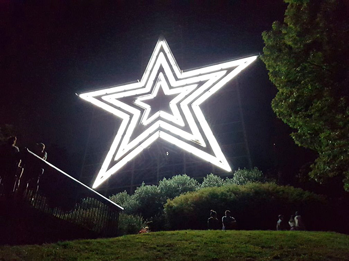 When darkness falls, the star transforms into Roanoke's nightlight, glowing faithfully over the sleeping valley below.