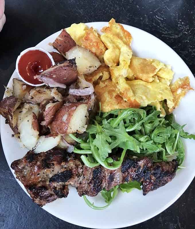 Fluffy scrambled eggs meet perfectly seasoned steak and crispy potatoes in this hearty breakfast plate that fuels any morning right.