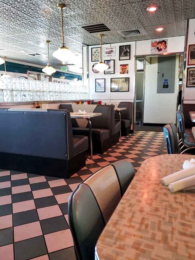 The view from this angle shows off those gorgeous checkered floors and classic diner seating that Instagram influencers dream about.