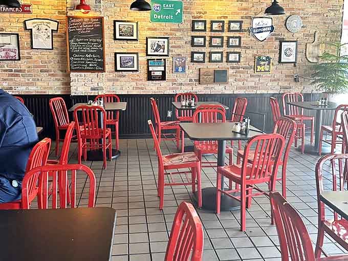 Red chairs marching in formation like a delicious army ready to seat hungry pizza pilgrims seeking Detroit salvation.