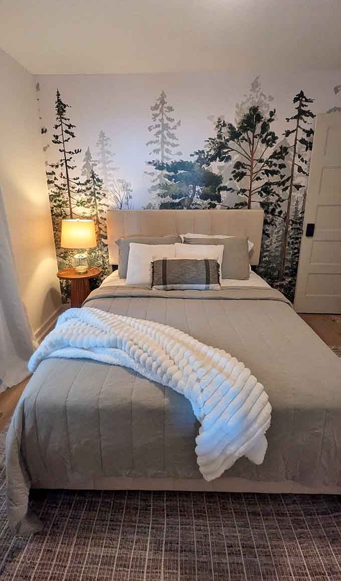 Forest murals meet cozy bedding in a combination that'll have you sleeping like a hibernating bear.