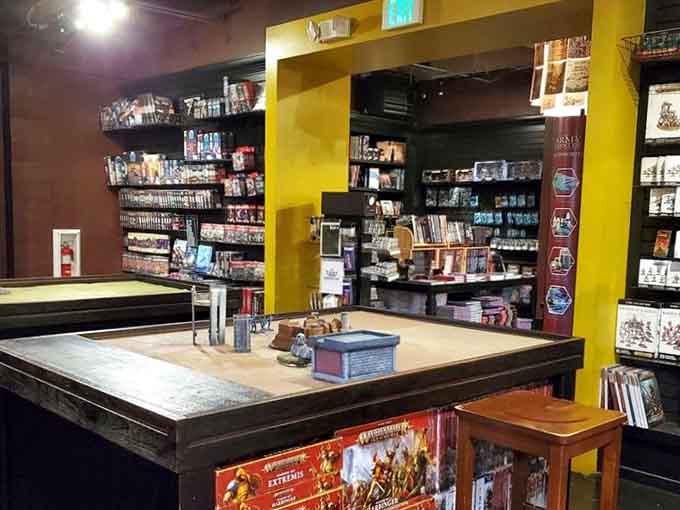 Bright yellow pillars and shelves stocked with games create a space that's equal parts retail therapy and entertainment hub.