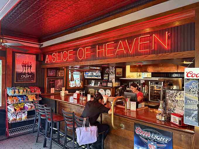 That neon "A Slice of Heaven" sign isn't just clever marketing&mdash;it's a legally binding promise they actually keep.