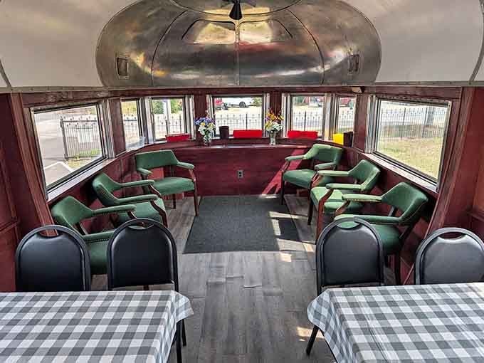 The observation car's plush seating proves that luxury travel existed long before first-class airline seats became a thing.