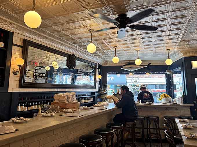 Counter seating where the action happens and every shucked oyster feels like a personal performance just for you.