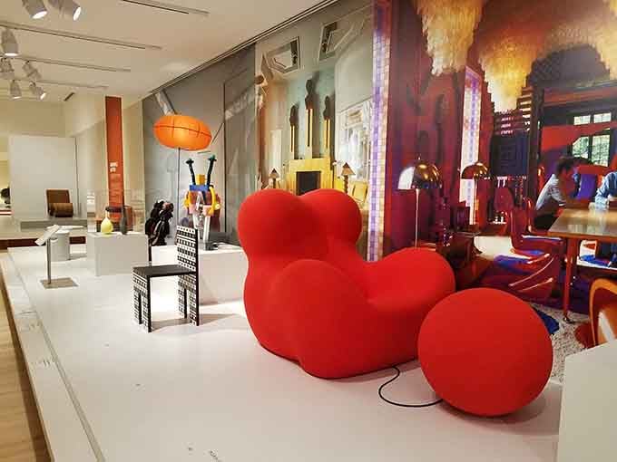 That red armchair looks like it escaped from a futuristic living room and landed in design heaven.