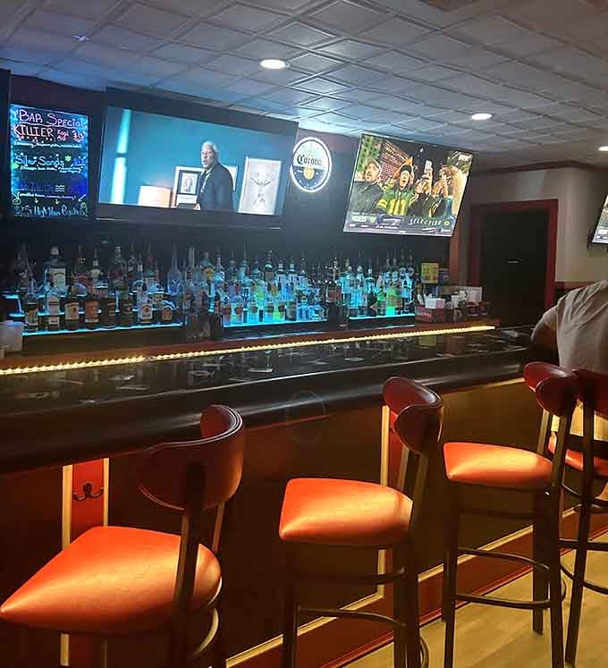 A backlit bar that looks like it belongs in a much fancier place but keeps the neighborhood vibe intact.