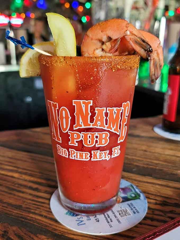 A Bloody Mary garnished with shrimp, because why should your drink be less interesting than your meal itself?