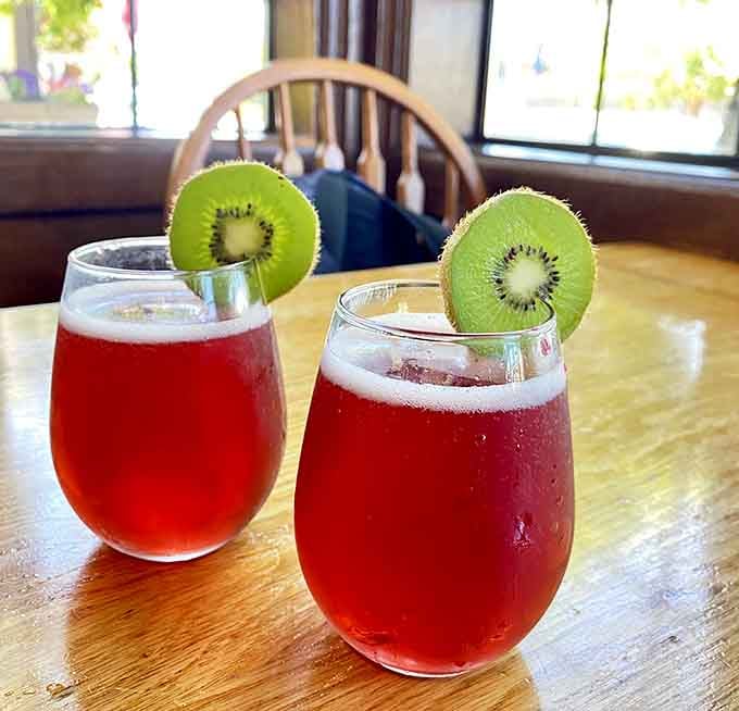 Mimosas garnished with kiwi slices bring a touch of tropical whimsy to your Pacific Northwest breakfast experience.