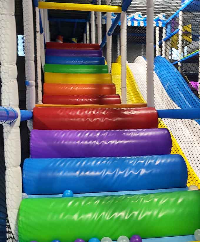 Rolling cylinders test coordination skills while providing endless entertainment, assuming you enjoy watching kids tumble around gleefully.