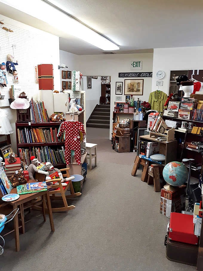 Children's furniture meets vintage globes in a corner that celebrates curiosity, exploration, and simpler playtime eras beautifully.