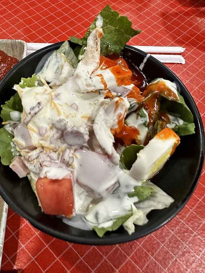 Even the salads here get the barbecue treatment, because vegetables deserve to party with smoked chicken too.