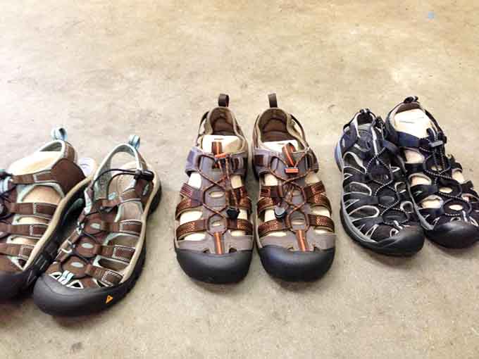 Outdoor sandals lined up like they're auditioning for summer adventures, each pair with plenty of miles left.