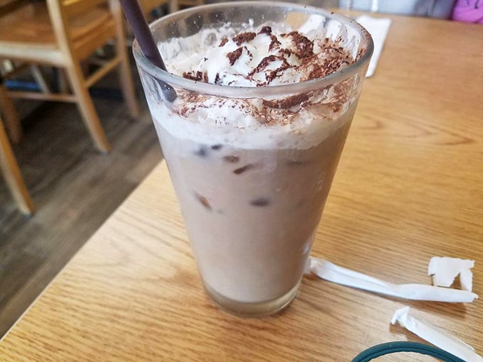 Iced coffee with chocolate shavings on top because sometimes you need caffeine and dessert to team up together perfectly.