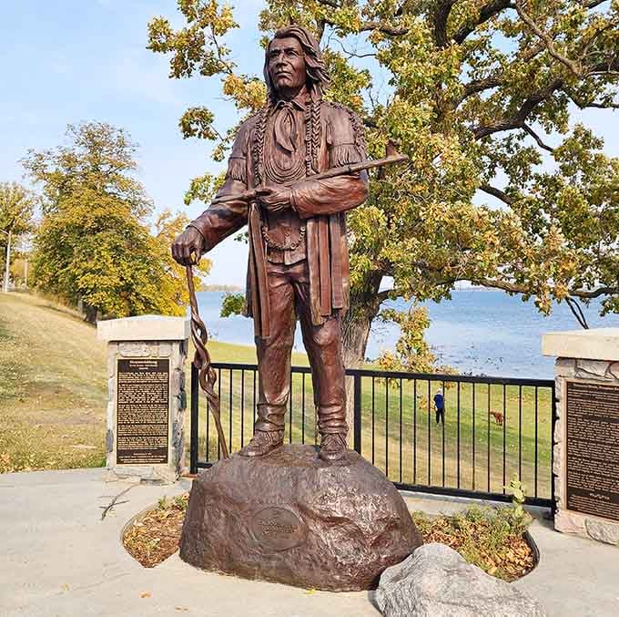 Chief Shaynowishkung stands dignified against autumn's golden backdrop, honoring the land's true original storytellers and stewards.