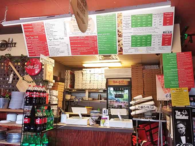 Behind this counter, pizza dreams are assembled into reality by folks who clearly don't understand the word "moderation."