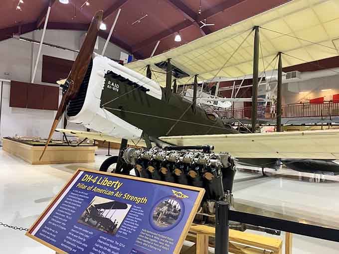 The DH-4 Liberty's exposed engine reveals the mechanical artistry that powered aviation's golden age of innovation.