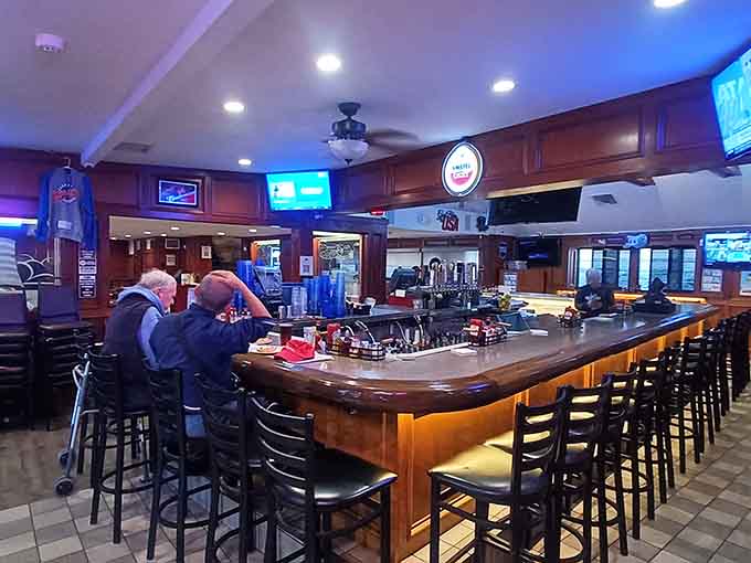 The bar area offers the perfect spot to contemplate your pizza strategy while enjoying a cold beverage.