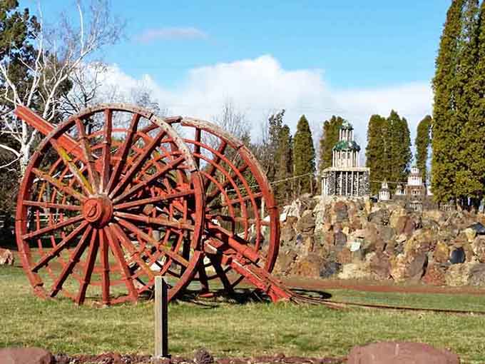 Antique farm equipment adds rustic charm to this landscape where whimsy and history shake hands and become friends.