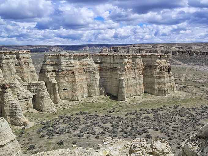 The dramatic sky and towering formations create a scene so perfect it almost looks staged by a Hollywood production designer.
