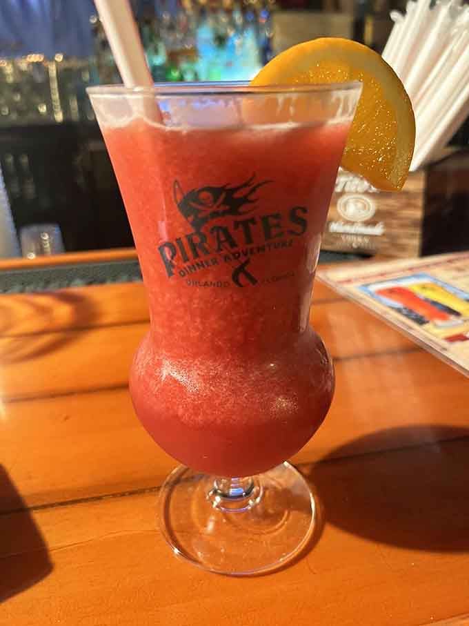 A frozen daiquiri garnished with fruit, the kind of drink that makes you understand why pirates loved the Caribbean.
