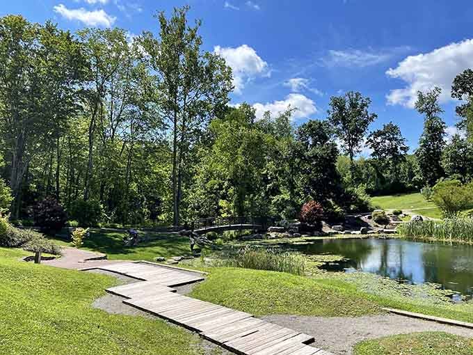 Wooden walkways wind through serene ponds, inviting you to slow down and actually notice the world around you.
