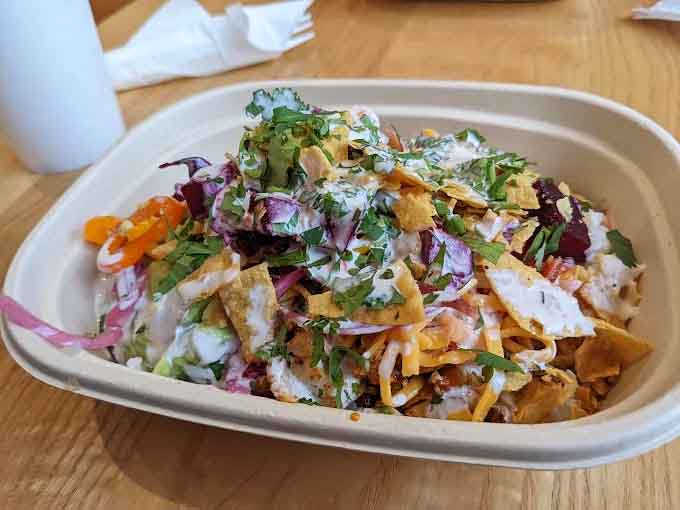 Loaded nachos pile high with colorful toppings, creating a mountain of flavor worth climbing.