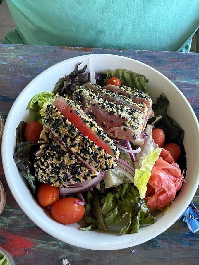 Sesame-crusted tuna perched atop fresh greens proves healthy eating doesn't have to mean sacrificing flavor or fun.