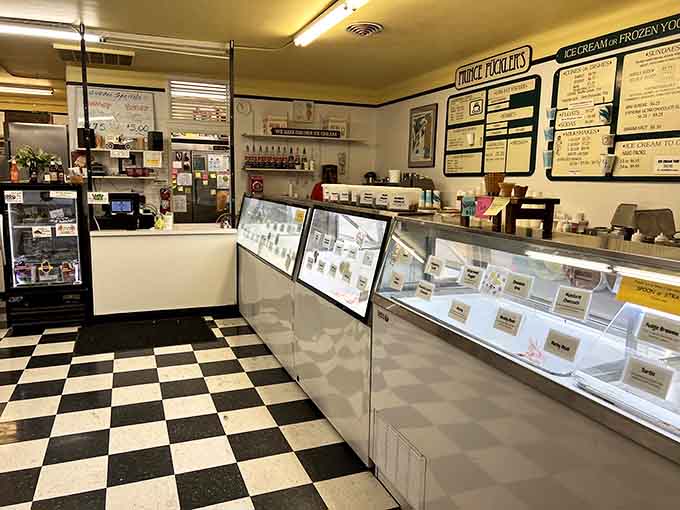 The counter where dreams are scooped and life's problems temporarily dissolve into creamy, cold solutions for everyone.