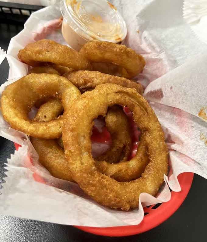 Onion rings so perfectly golden and crispy, they deserve their own spot in the fried food hall of fame.