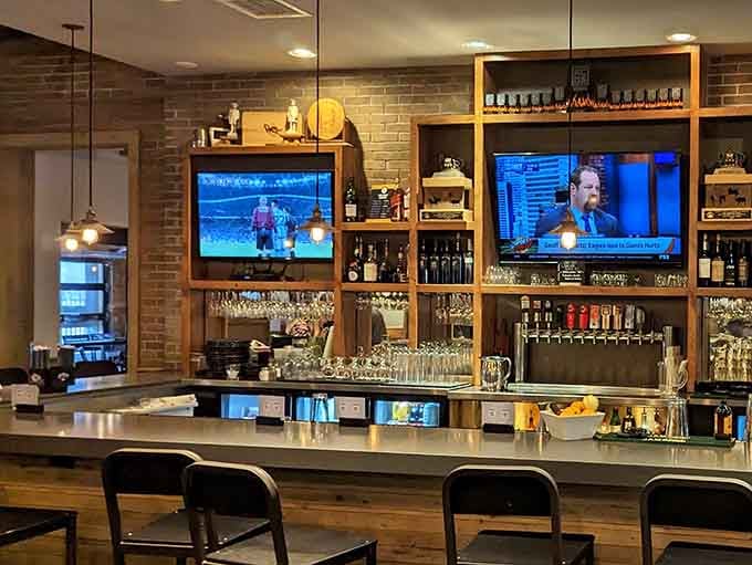 The bar area features craft beers and bourbon because barbecue deserves equally thoughtful beverage companions.