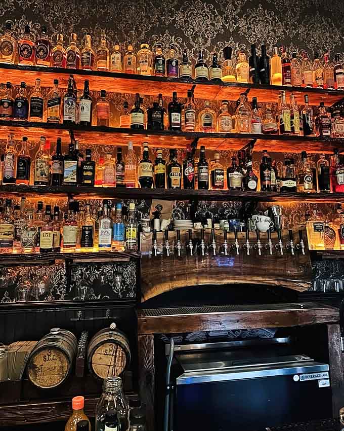 The bar showcases an impressive spirits collection that would make any cocktail enthusiast stop and stare admiringly.