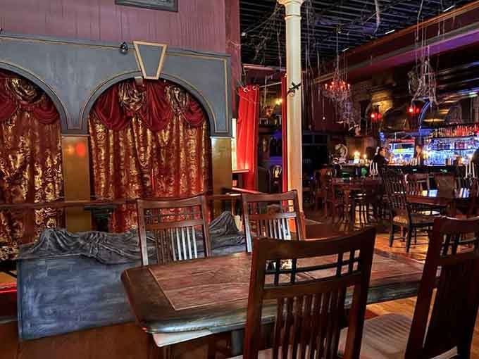 Ornate curtains and vintage seating create distinct spaces, each corner more photogenic than the last in this manor.