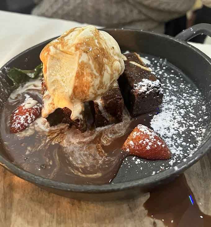 Warm chocolate brownie topped with vanilla ice cream and fresh strawberries&mdash;the kind of dessert that makes you forget your diet.