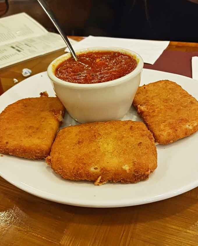 Golden fried mozzarella with marinara proves that some classics never need updating, just perfect execution every single time.