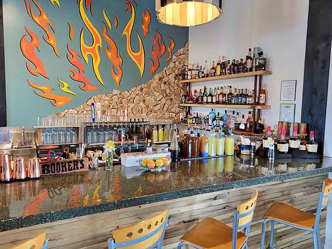 A bar backed by flames? That's the kind of dramatic flair that matches the bold flavors on every plate.