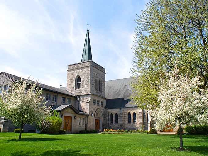 This stone church with its graceful steeple represents the kind of craftsmanship that modern buildings rarely attempt anymore.